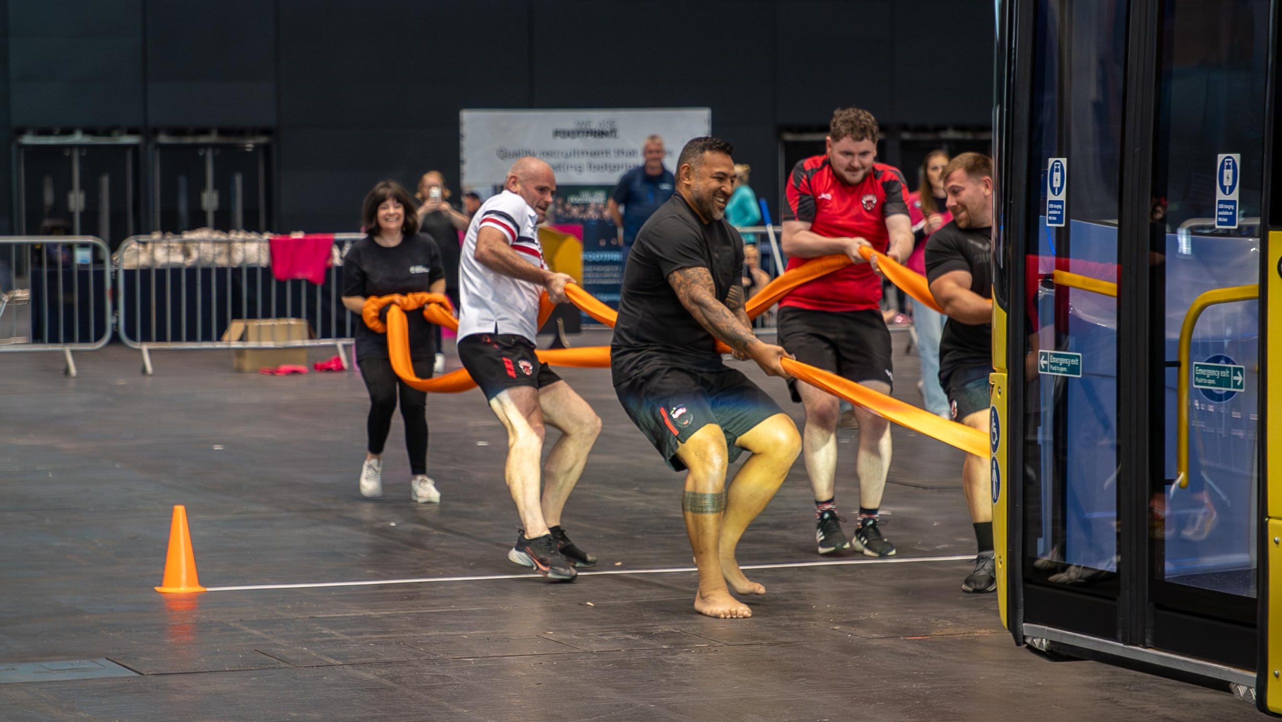 Red Devils take on Bus Pull Challenge raising thousands to help end ...